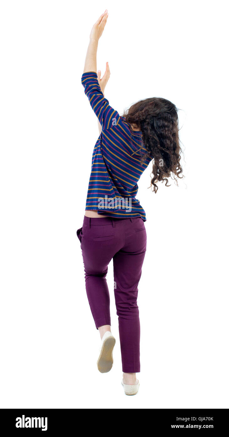 back view of dancing young beautiful woman. girl watching Stock Photo ...