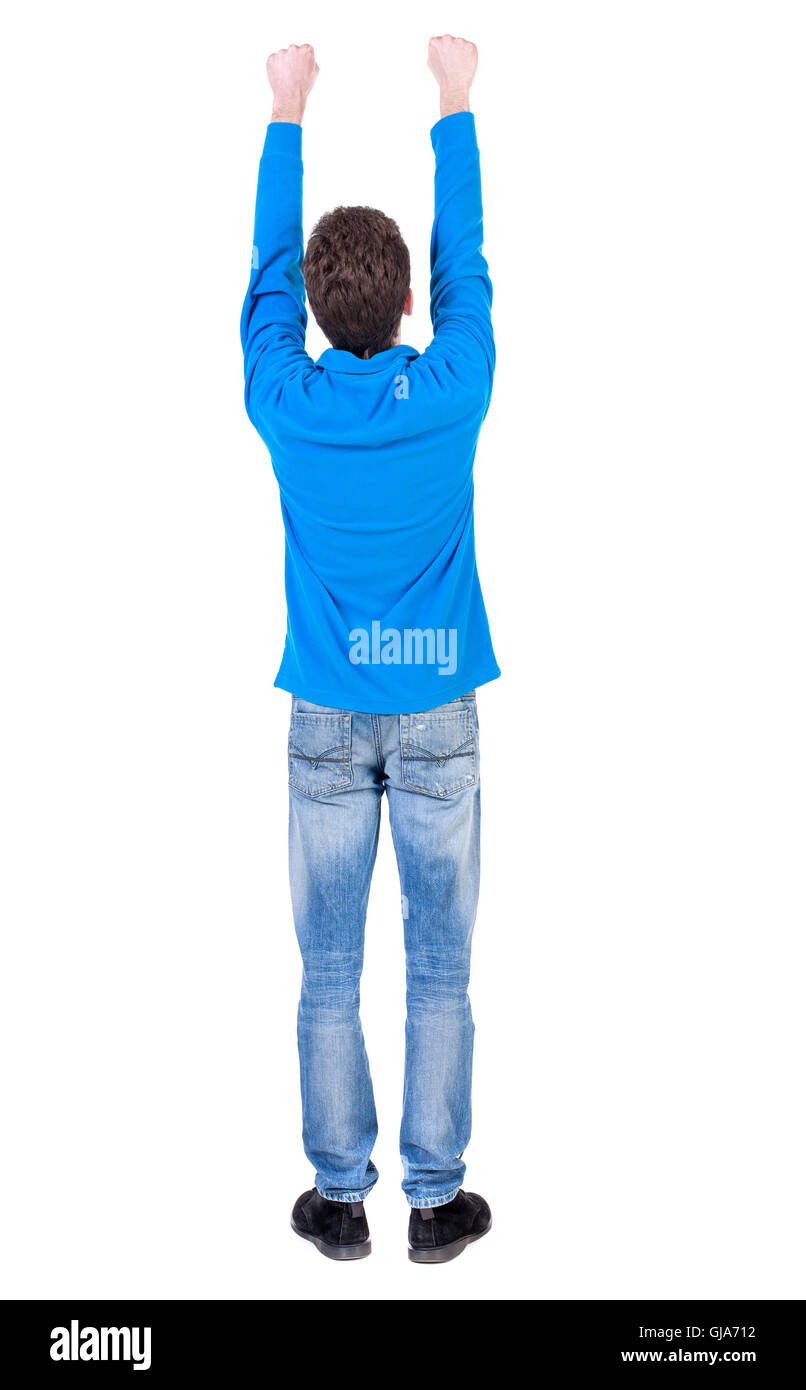 Back view of man. Raised his fist up in victory sign Stock Photo - Alamy