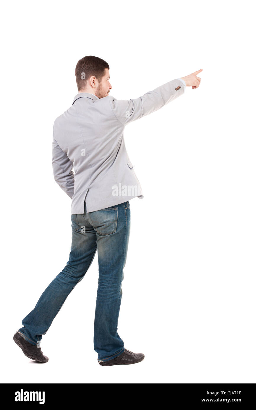 Back view of going business man pointing Stock Photo - Alamy
