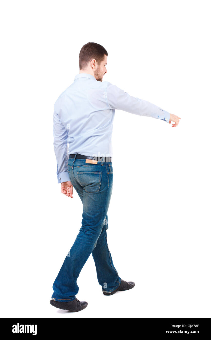 Back view of going business man pointing Stock Photo - Alamy