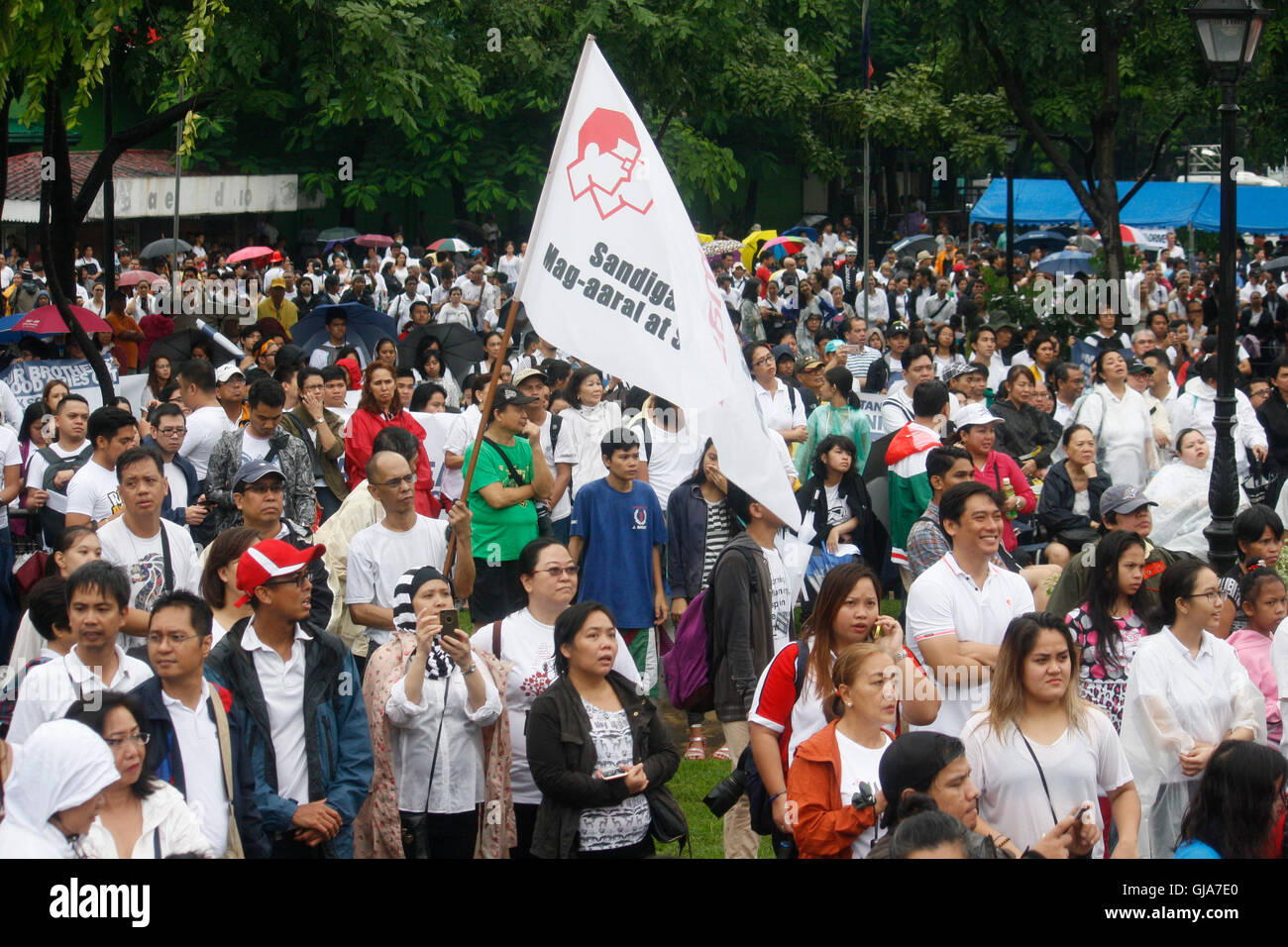 Filipinos participate at a citizens' assembly in Rizal Park protesting ...
