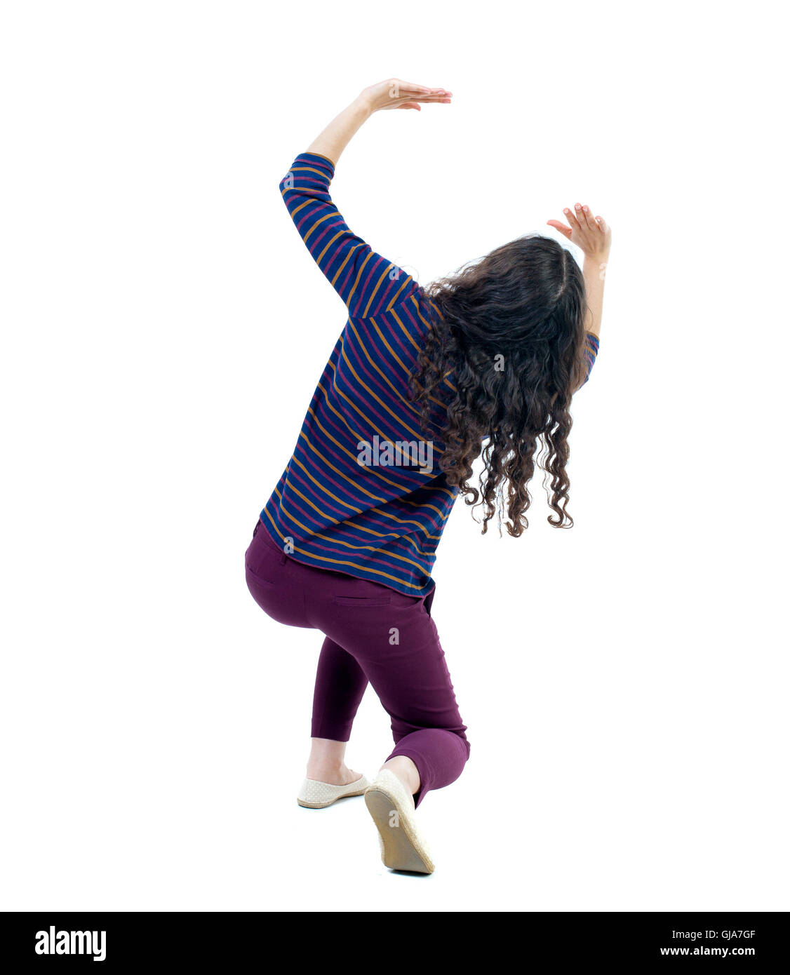 back view of woman protects hands from what is falling Stock Photo - Alamy