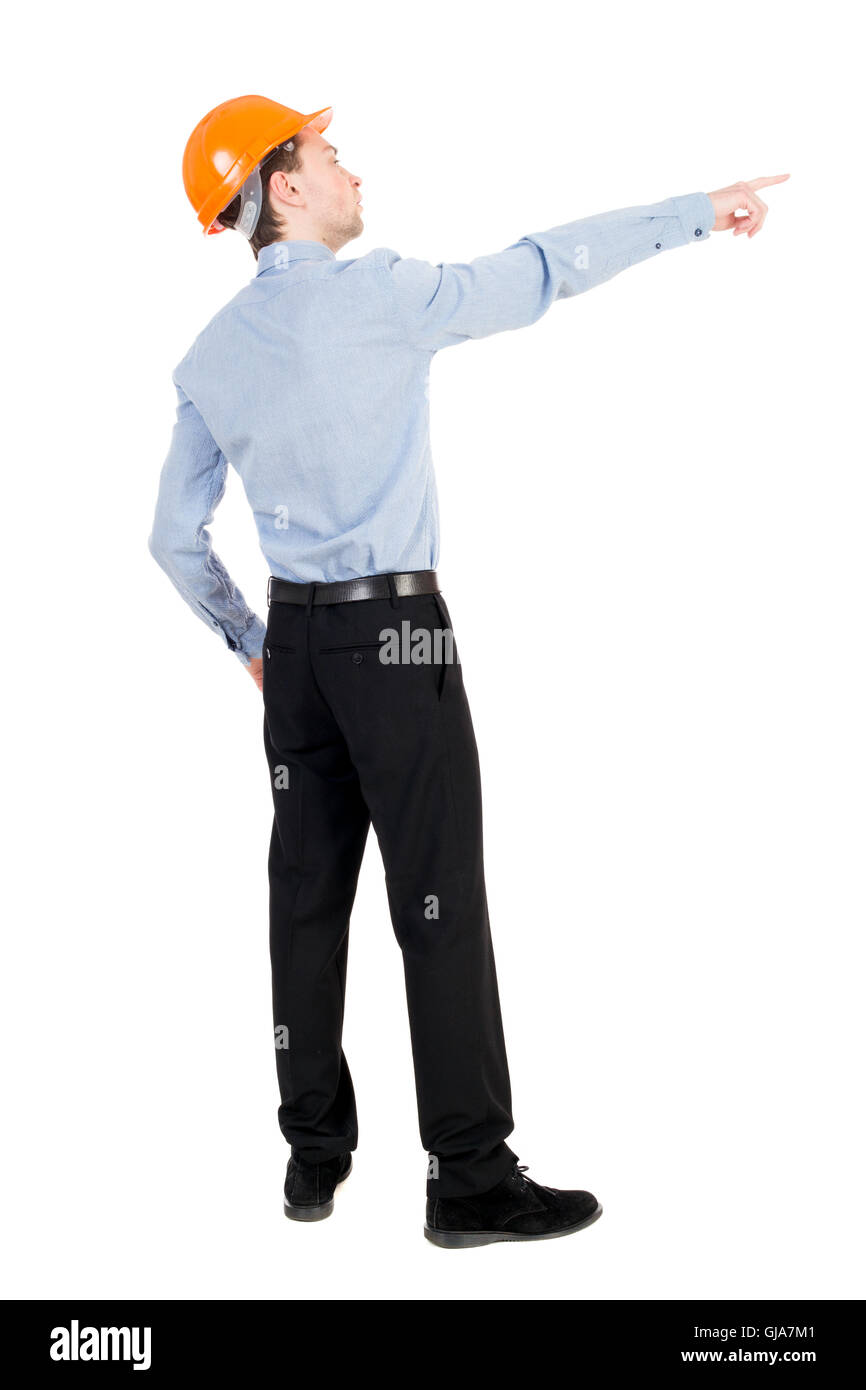 Back view of pointing young men in helmet Stock Photo - Alamy