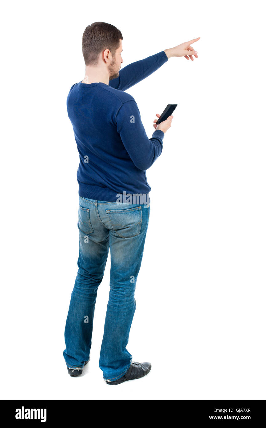 Back view of pointing young men talking on cell phone Stock Photo - Alamy
