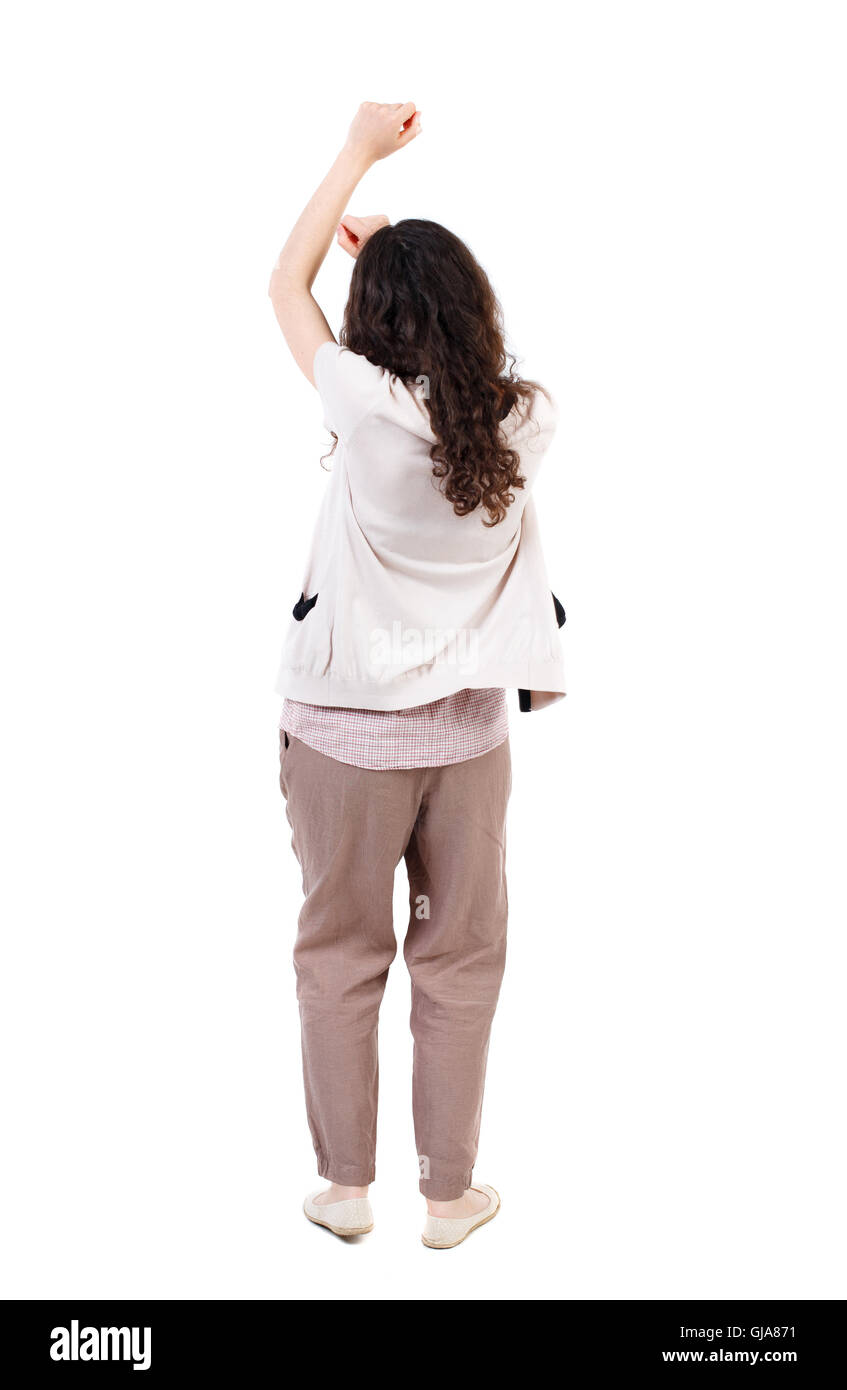 back view of dancing young beautiful woman. girl watching Stock Photo ...