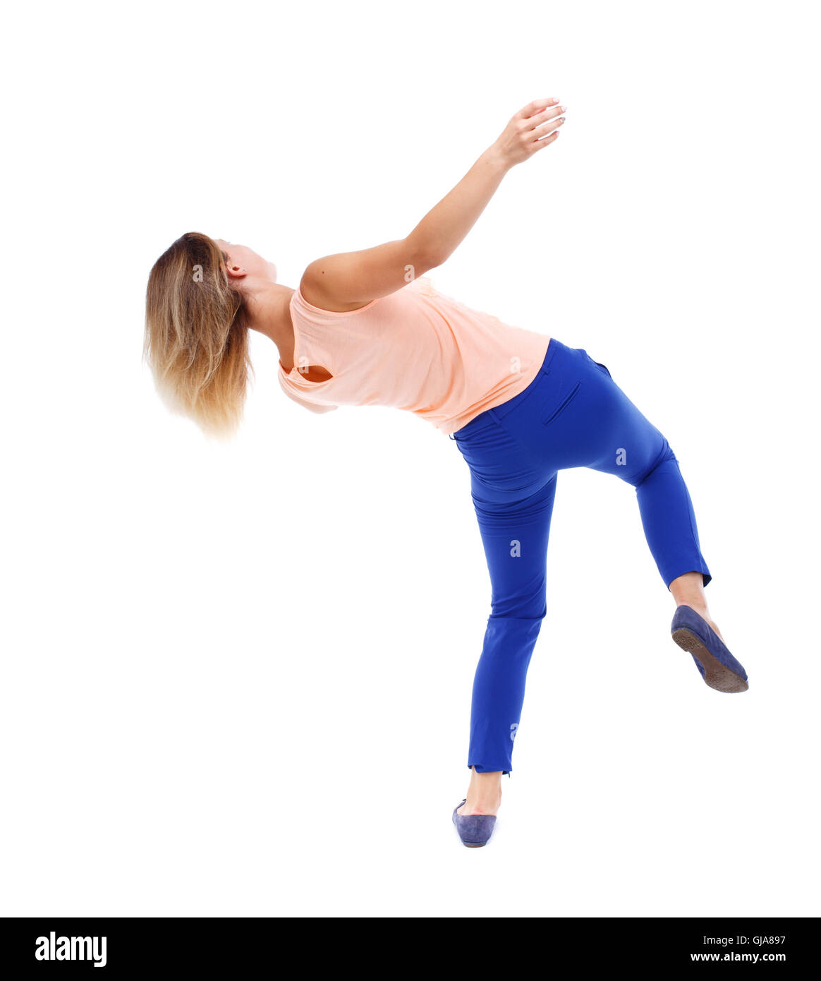 Balancing young woman Stock Photo - Alamy