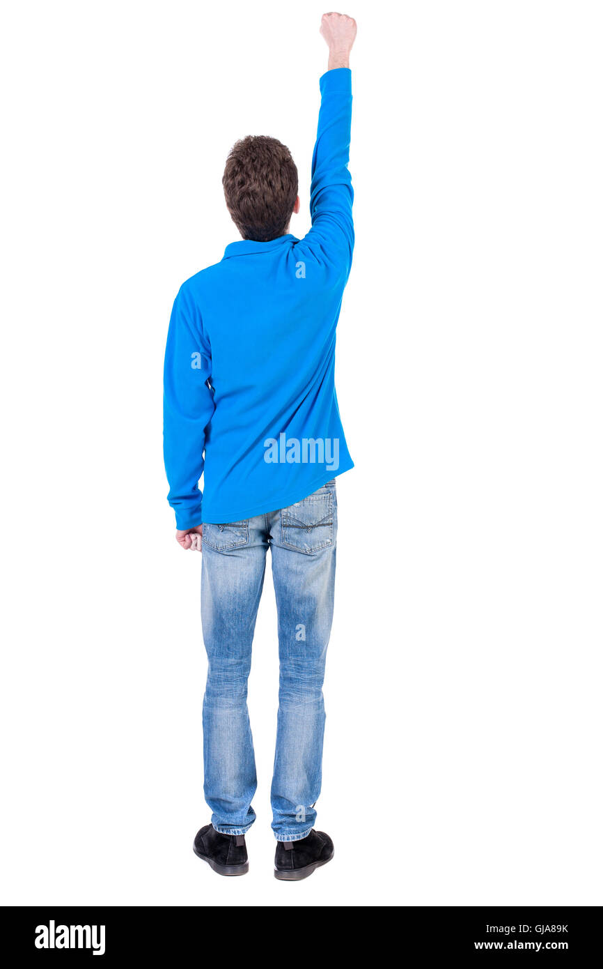Back view of man. Raised his fist up in victory sign Stock Photo - Alamy