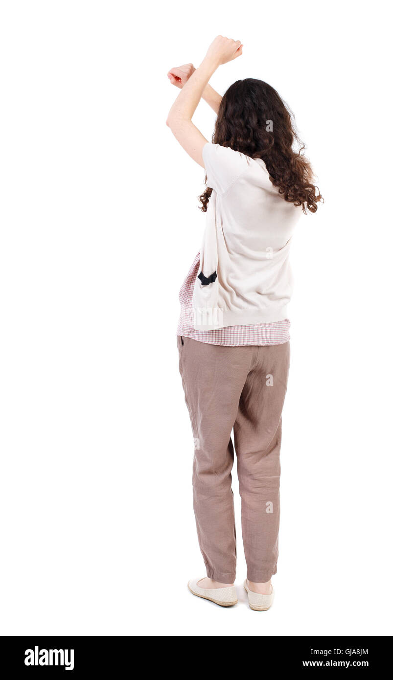 back view of dancing young beautiful woman. girl watching Stock Photo ...