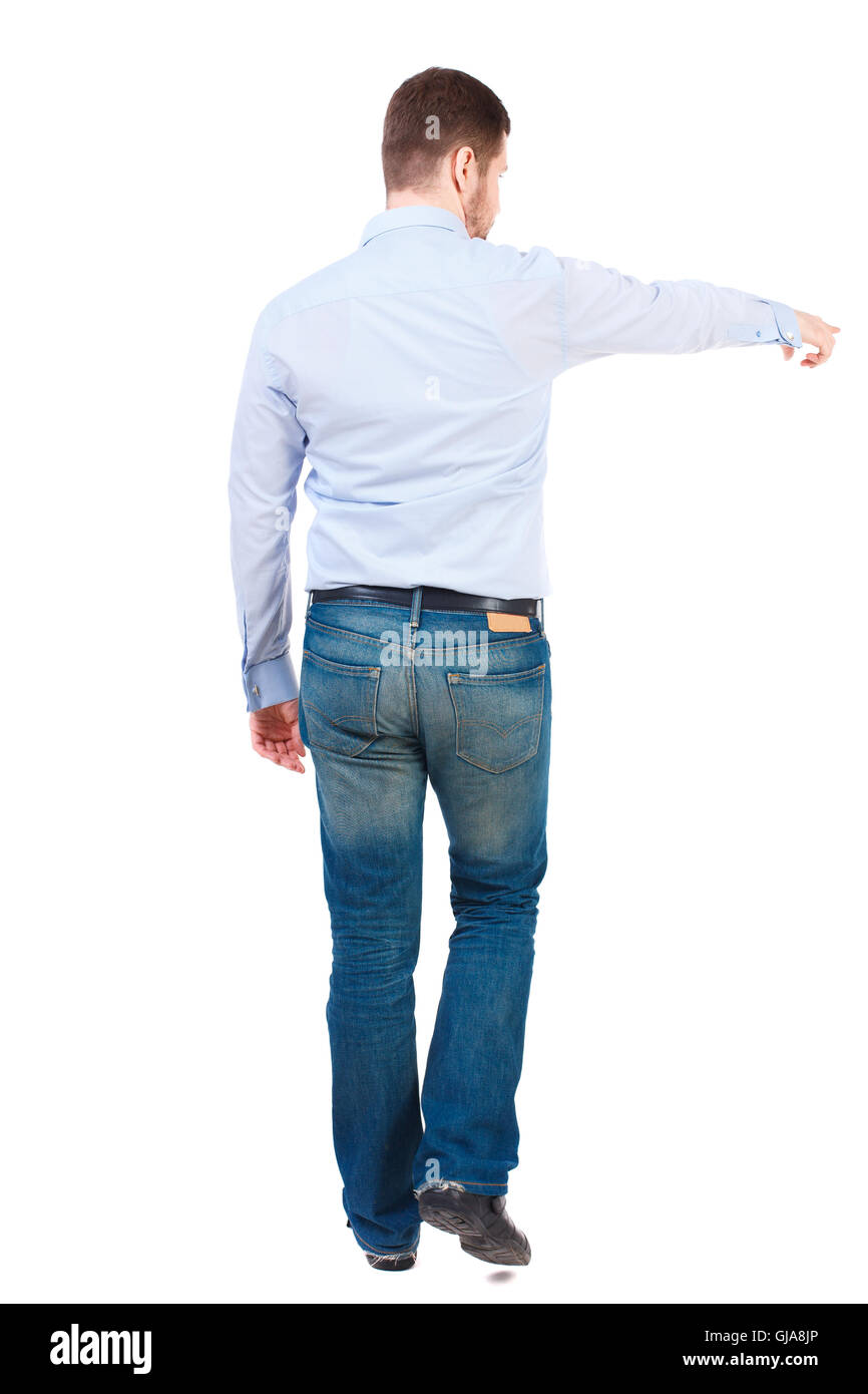 Back view of going business man pointing Stock Photo - Alamy