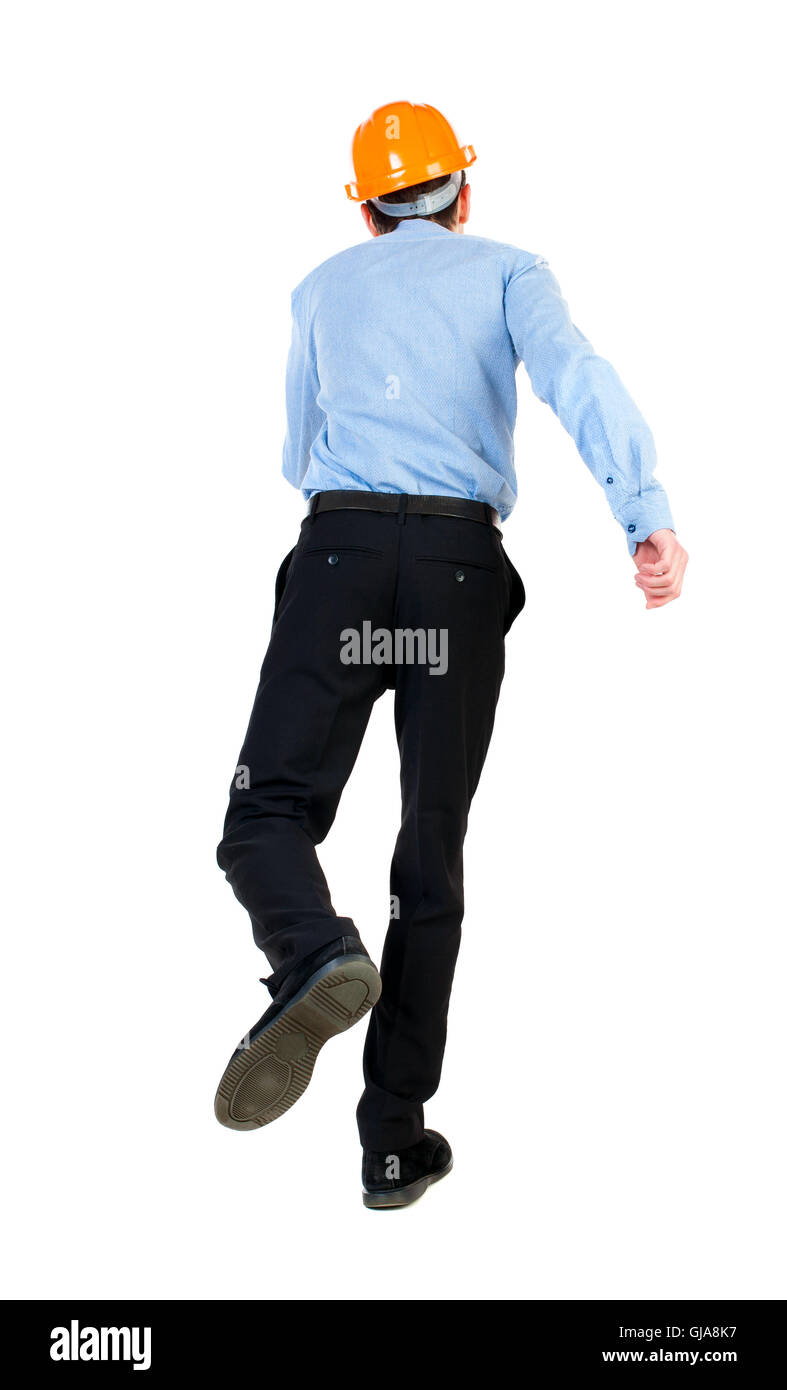 Back view of running engineer in helmet Stock Photo - Alamy