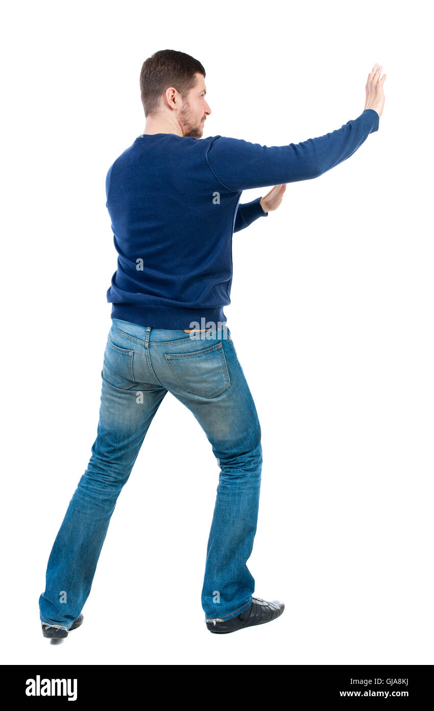 back view of business man pushes wall Stock Photo - Alamy