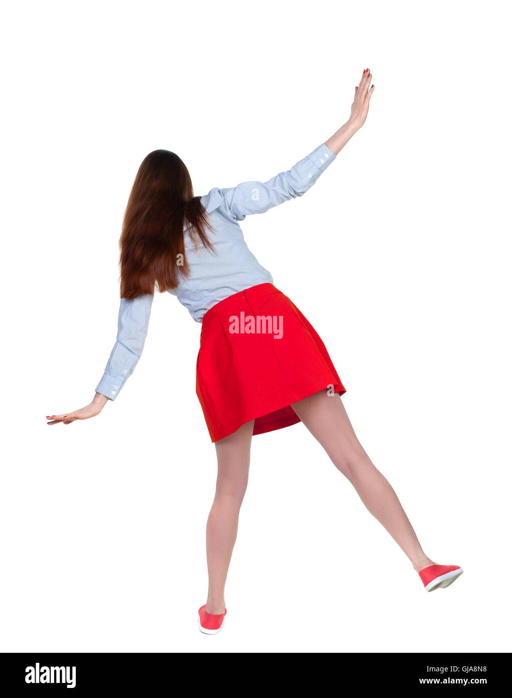 Balancing young woman Stock Photo - Alamy