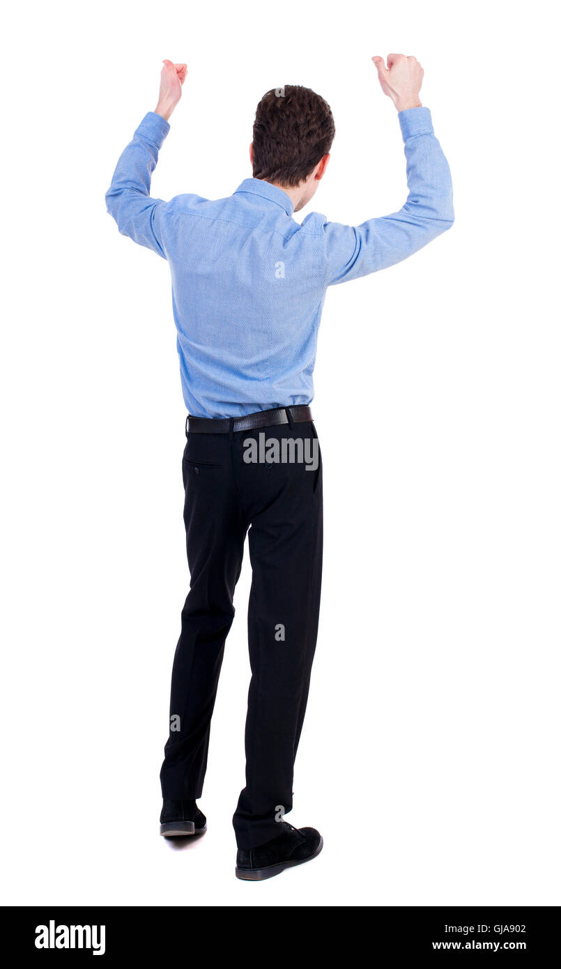 Back view of man. Raised his fist up in victory sign Stock Photo - Alamy