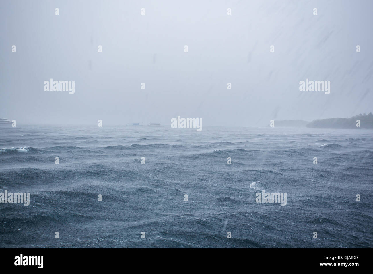 Rain over sea Stock Photo - Alamy
