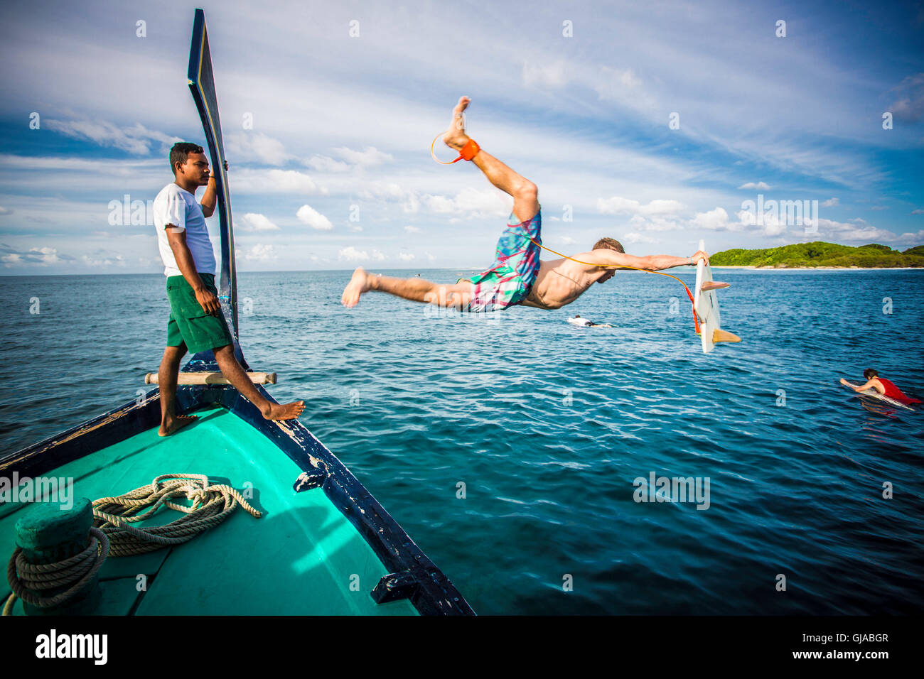 Man jumping into sea from boat hi-res stock photography and images - Alamy