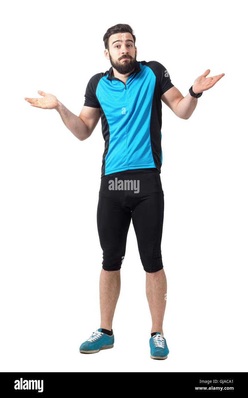 Confused clueless young athlete in cycling clothes shrugging shoulders ...