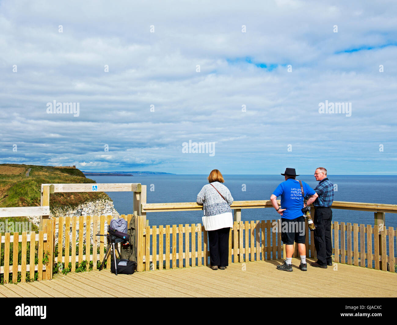 Bird watchers on viewing platform at Bempton Cliffs, an RSPB nature ...
