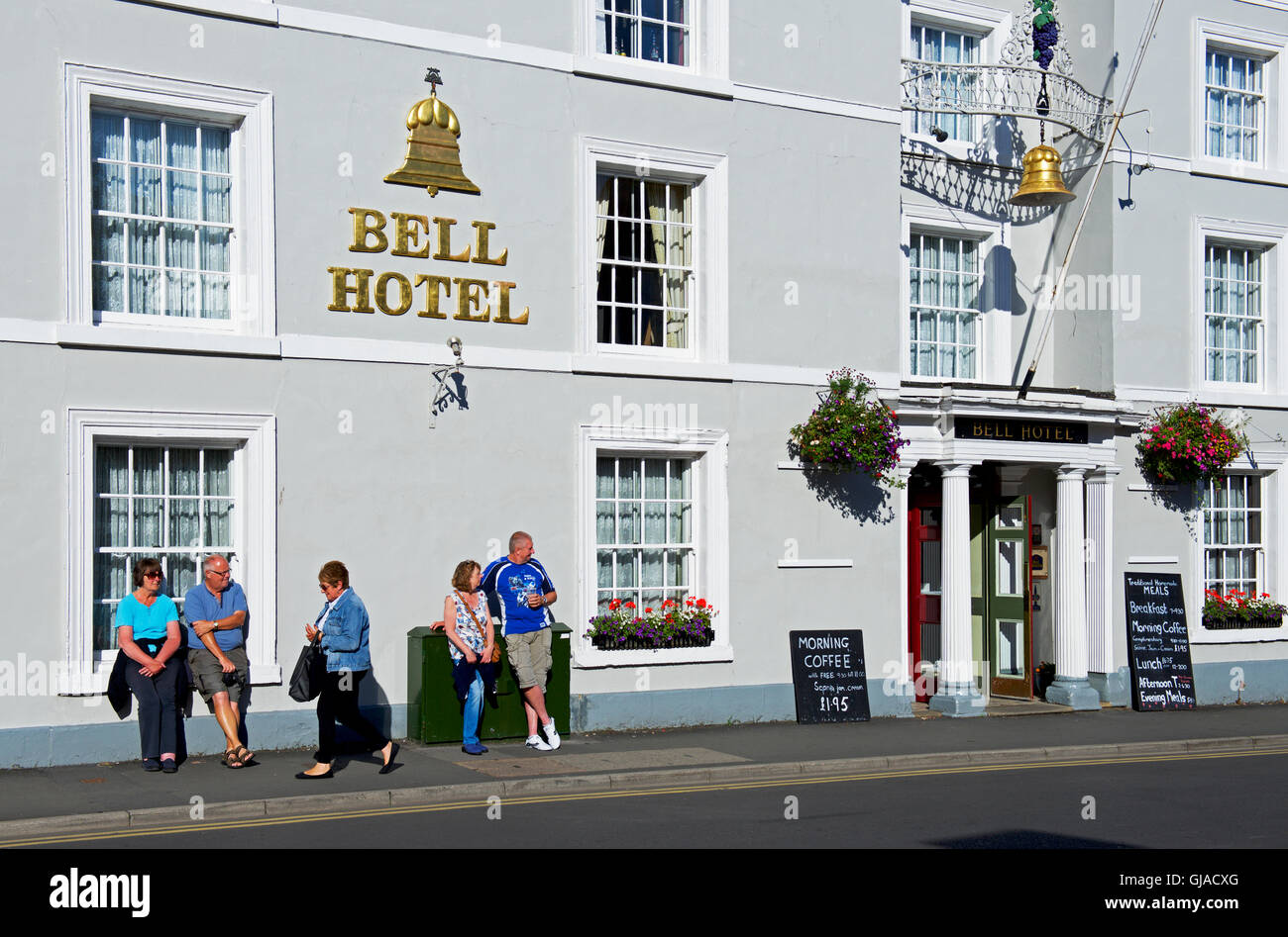 People standing outside the Bell Hotel, Driffield, East Yorkshire ...