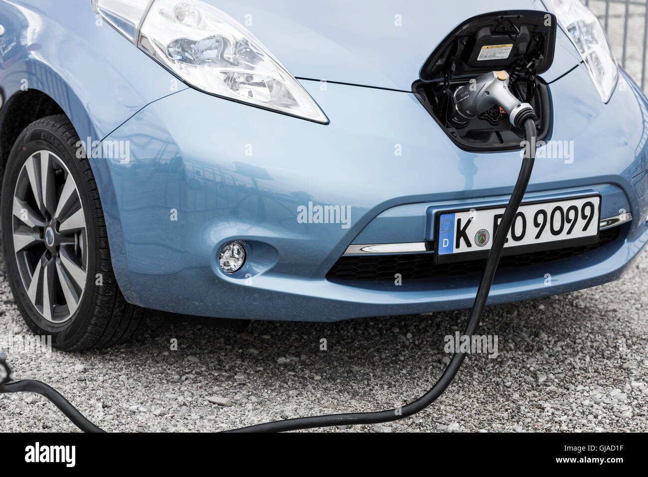 Electric car while loading Stock Photo - Alamy