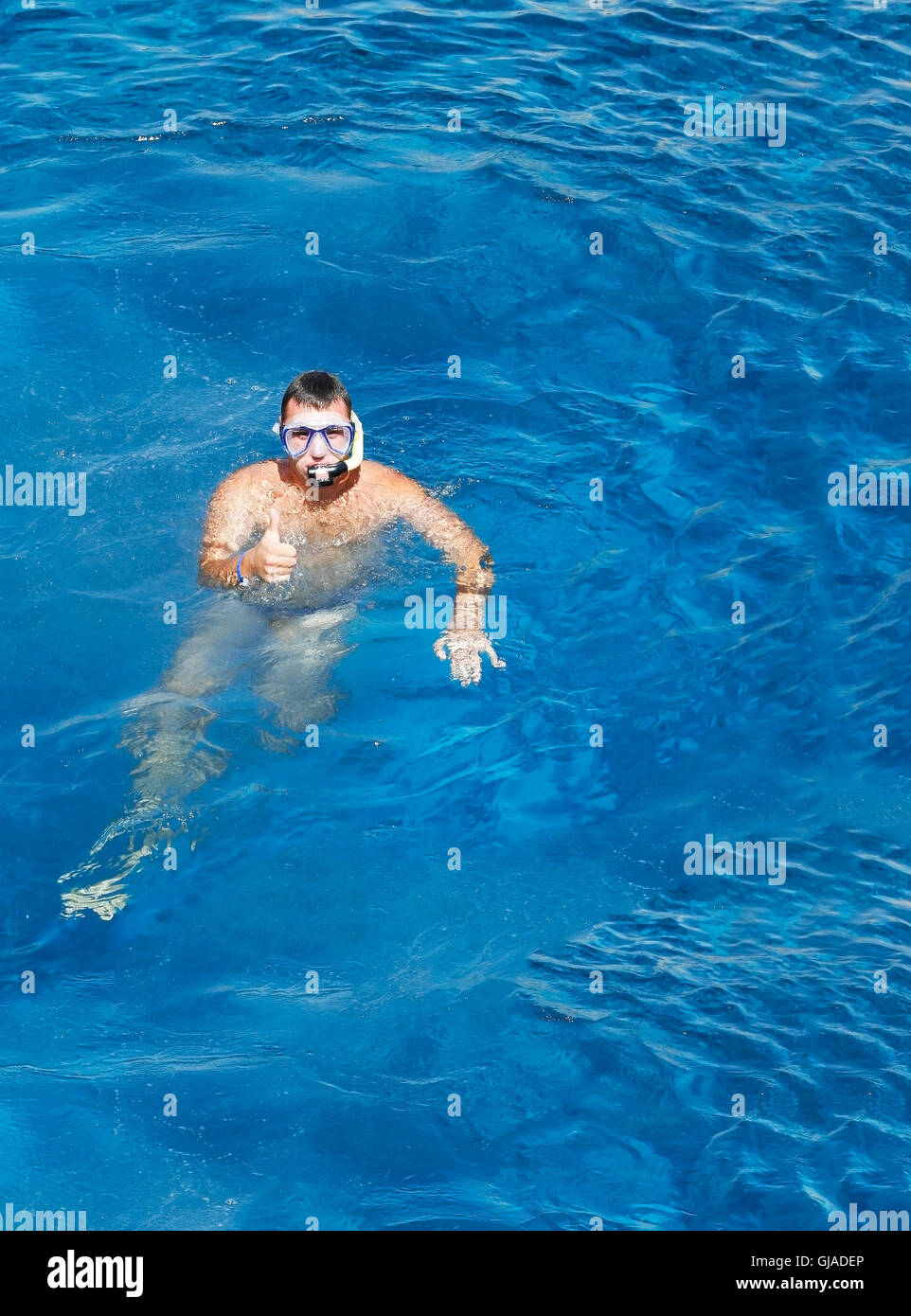 young man in a mask floats in the sea Stock Photo - Alamy