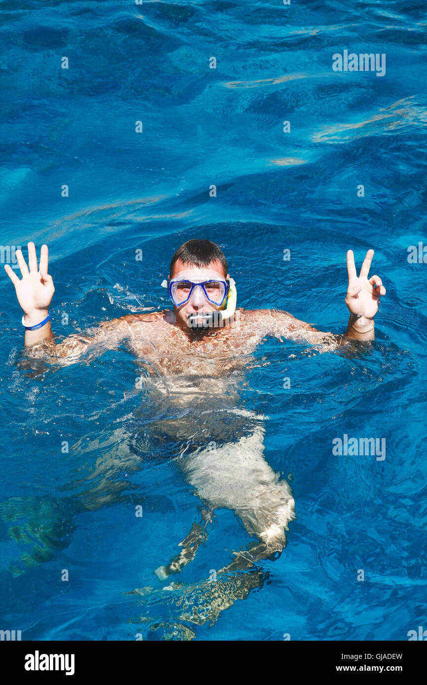 young man in a mask floats in the sea Stock Photo - Alamy