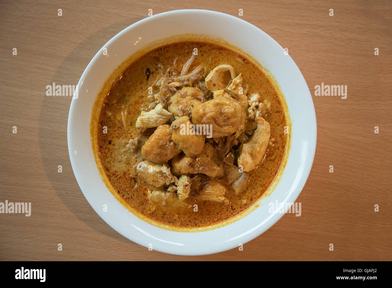 Chicken and tofu laksa a warm fragrant noodle soup dish Stock Photo - Alamy