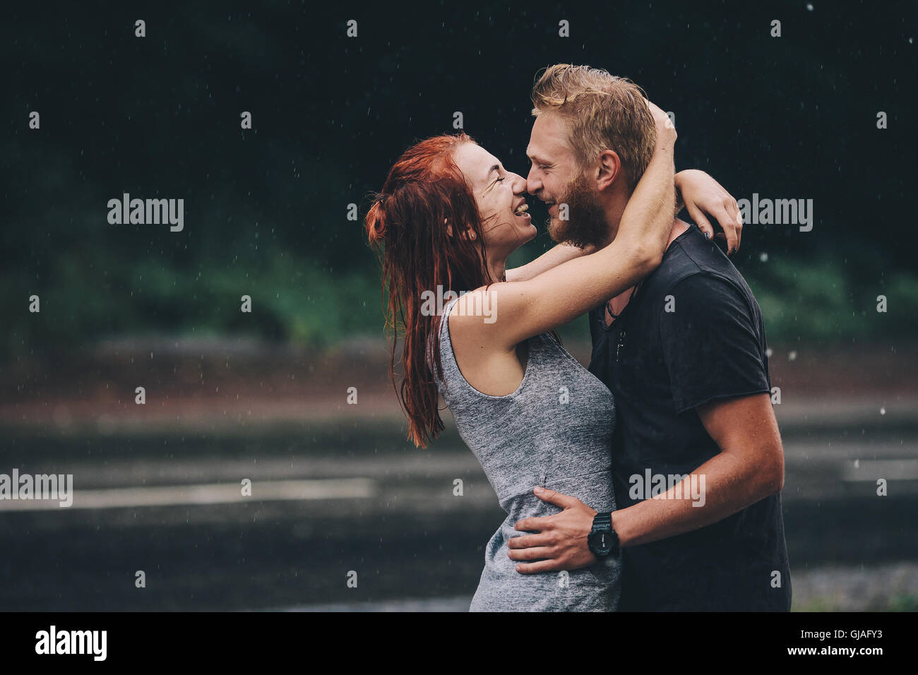 Beautiful couple hugging in rain hi-res stock photography and images ...