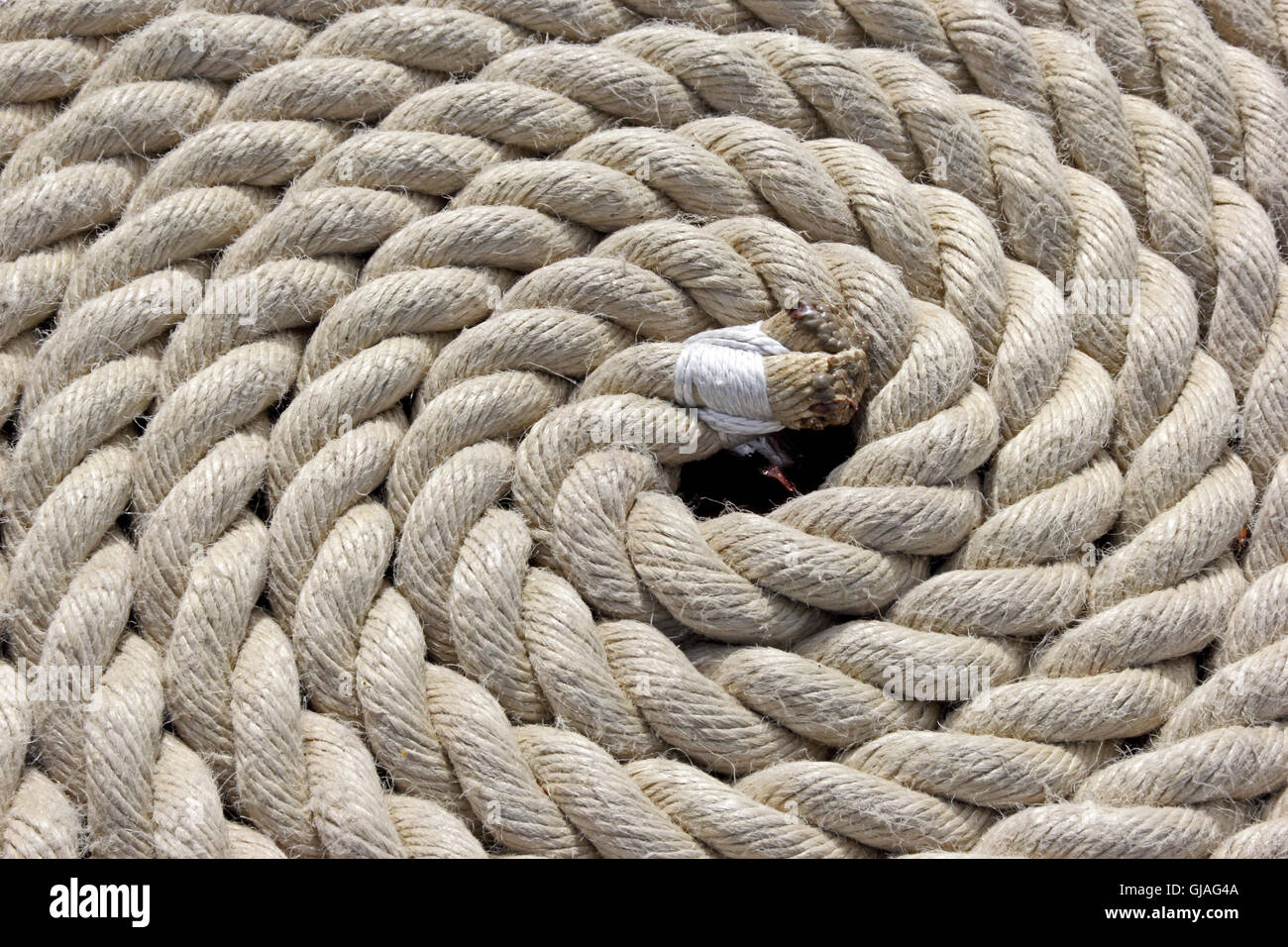 Rope coiled on deck of yacht Stock Photo - Alamy