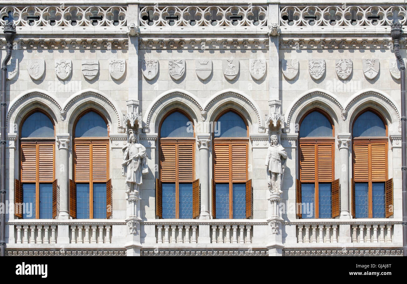 Gothic style windows with statues in Europe Stock Photo - Alamy