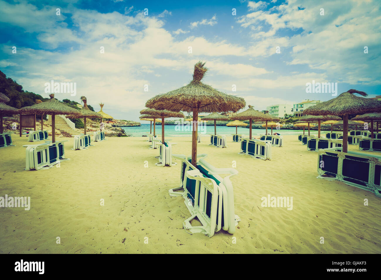 Sandy beach with parasols Stock Photo - Alamy