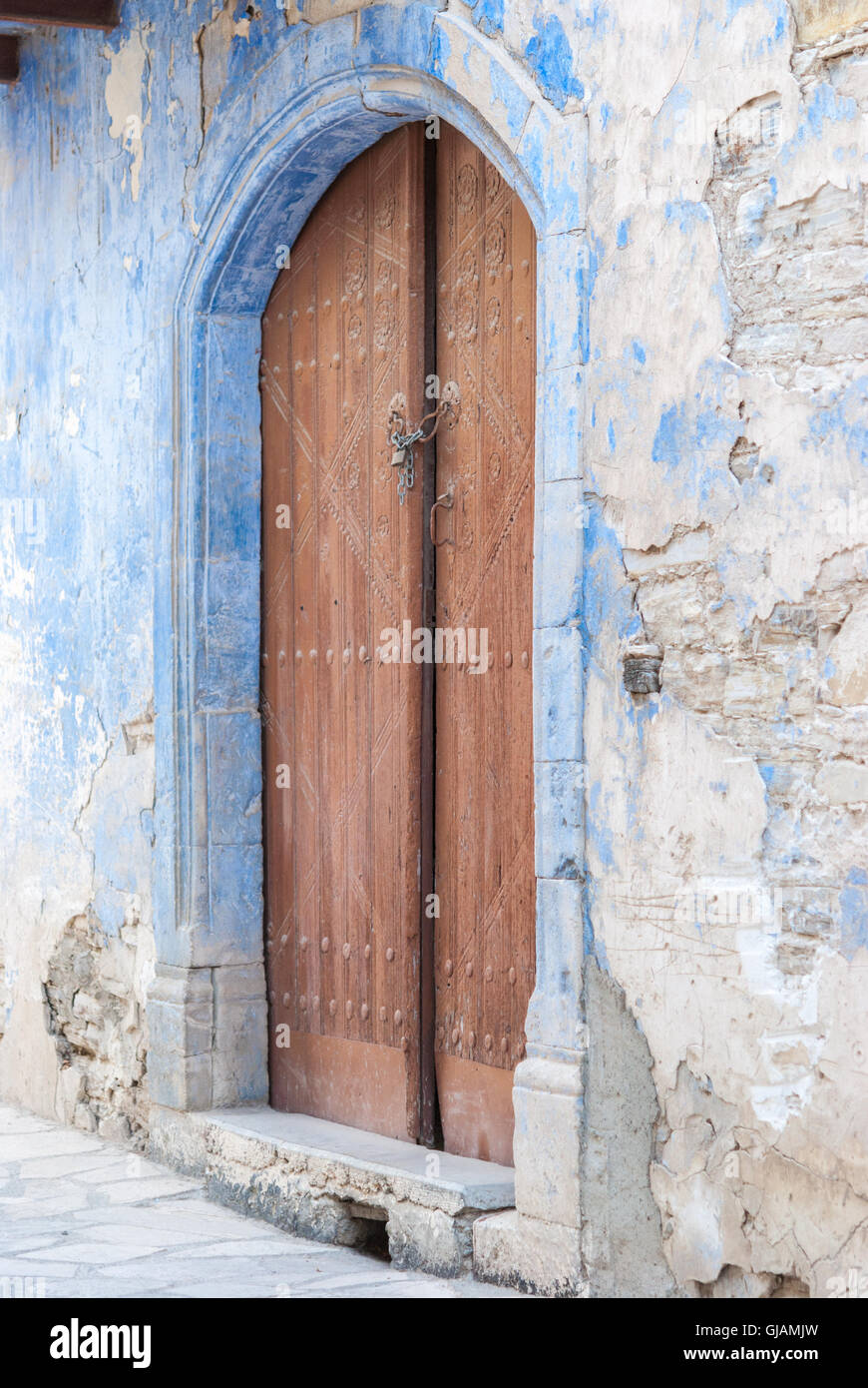 Old brown wooden door at the entrance of traditional greek-cypriot ...