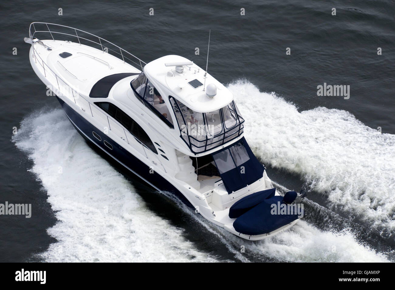 A blue and white speedboat shot from above while travelling fast Stock ...