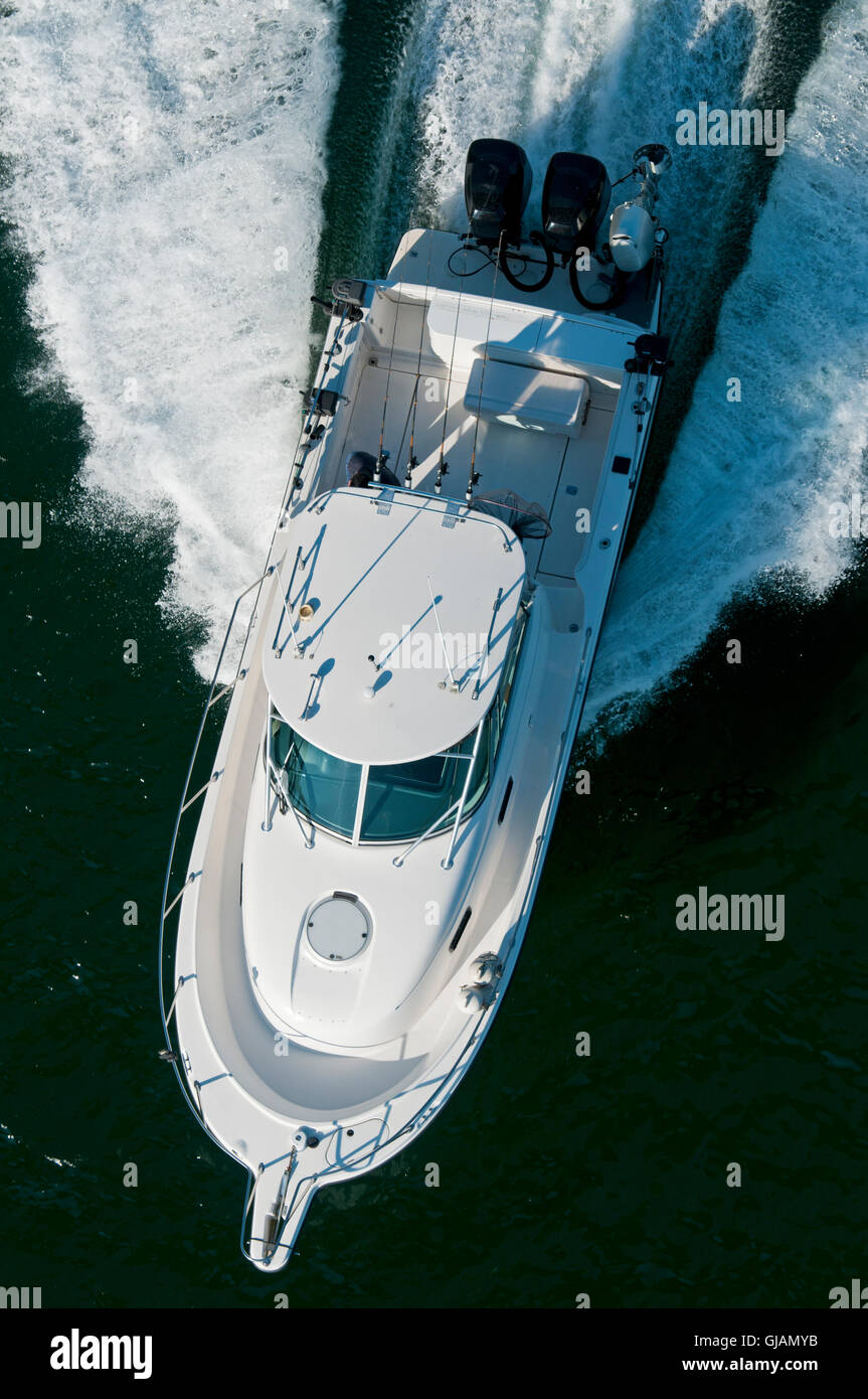 A speedboat moving through calm water in the Pacific Ocean Stock Photo ...