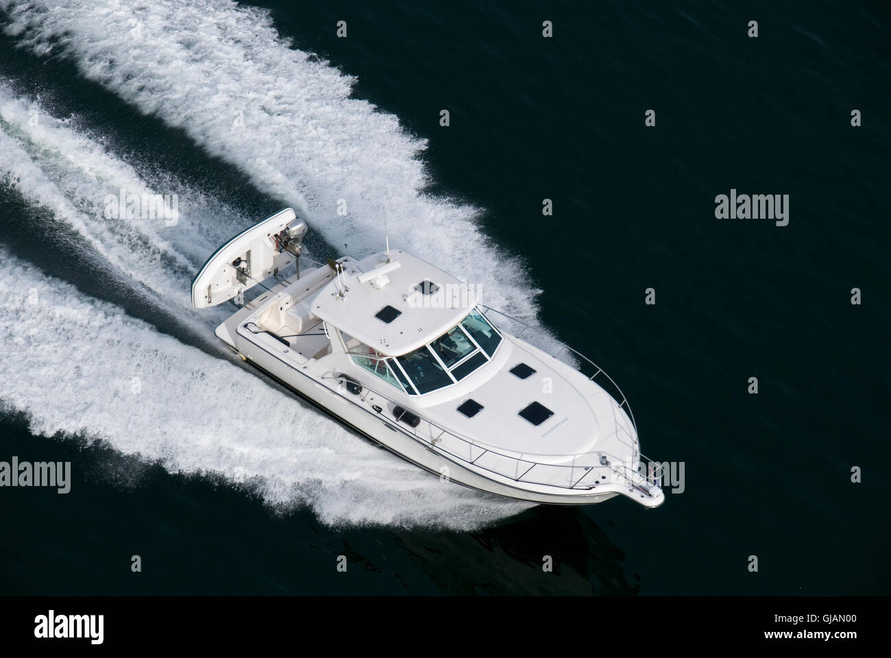 A white speedboat shot from above while travelling fast Stock Photo - Alamy
