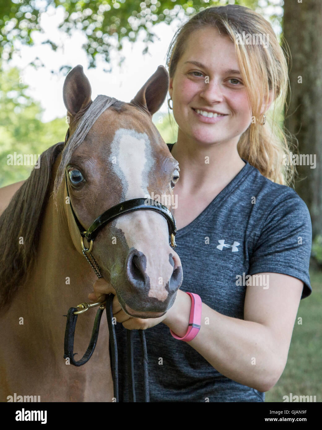 Woman with her miniature horse Stock Photo - Alamy
