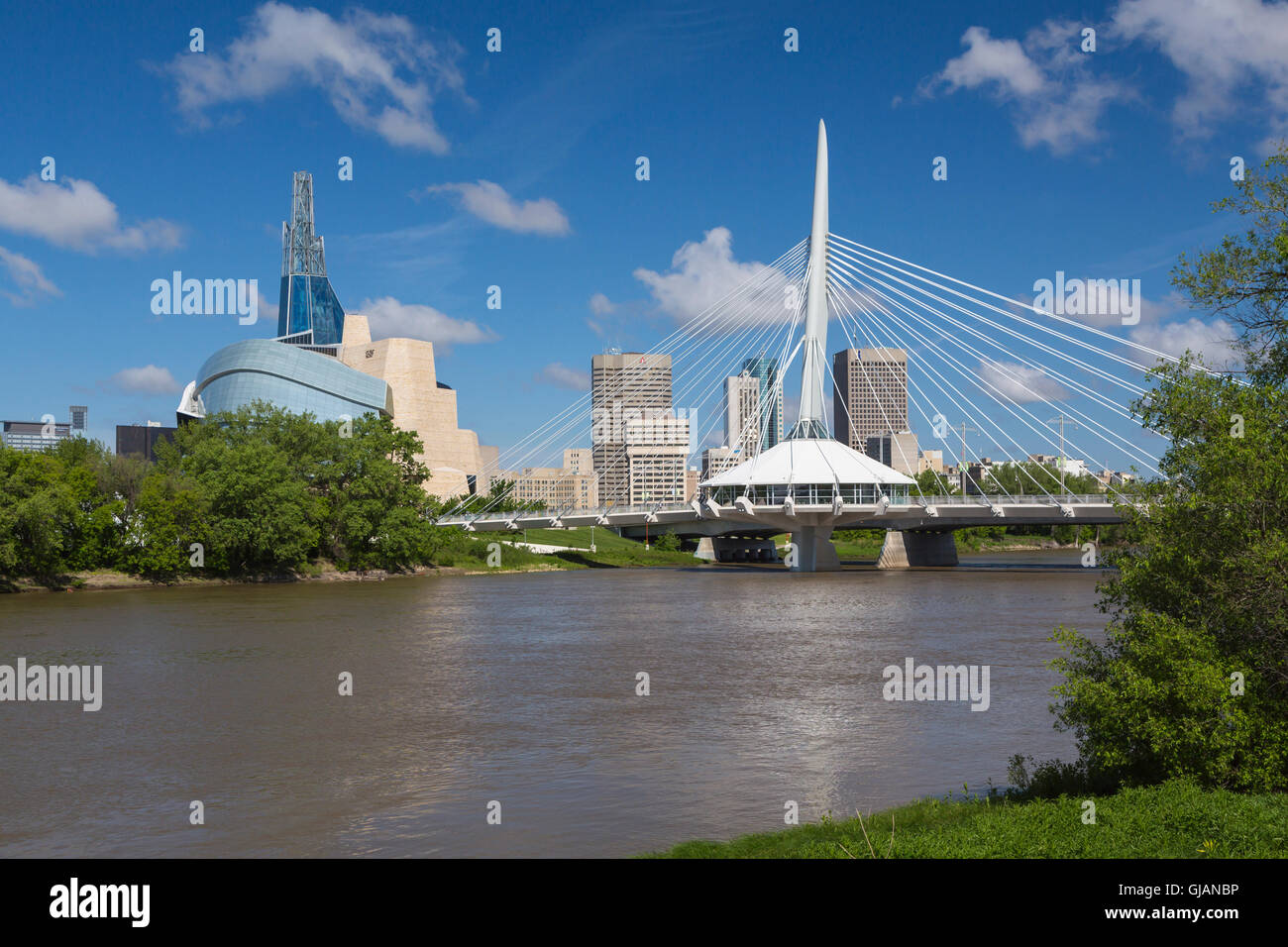 The Red River, Provencher Bridge and the city skyline of Winnipeg ...