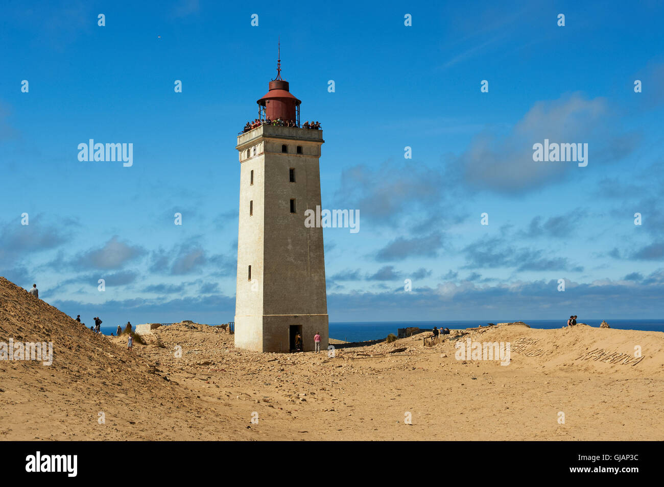 The old lighthouse, partially burried in sand, at Rubjerg Knude ...
