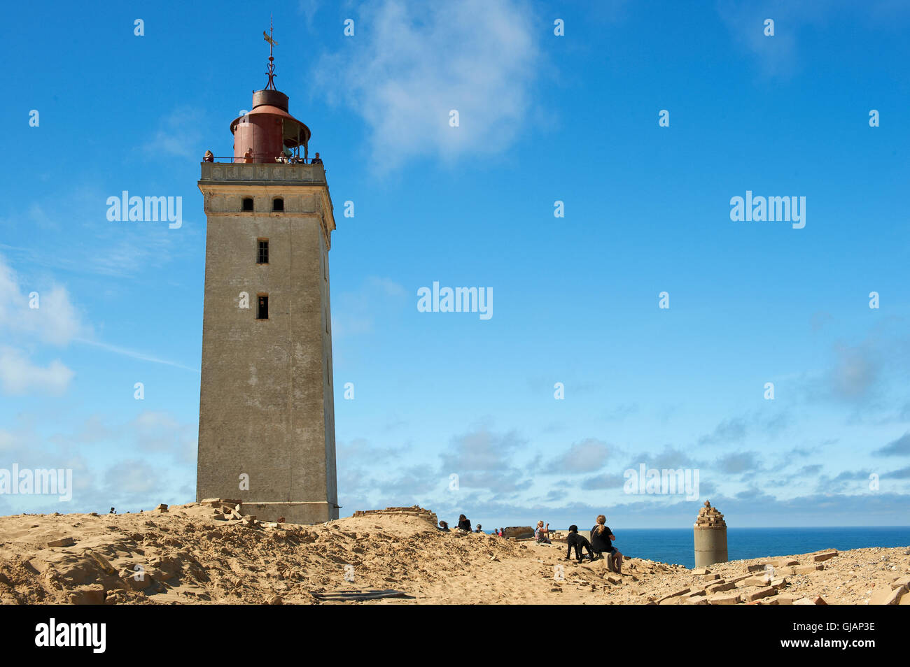 The old lighthouse, partially burried in sand, at Rubjerg Knude ...