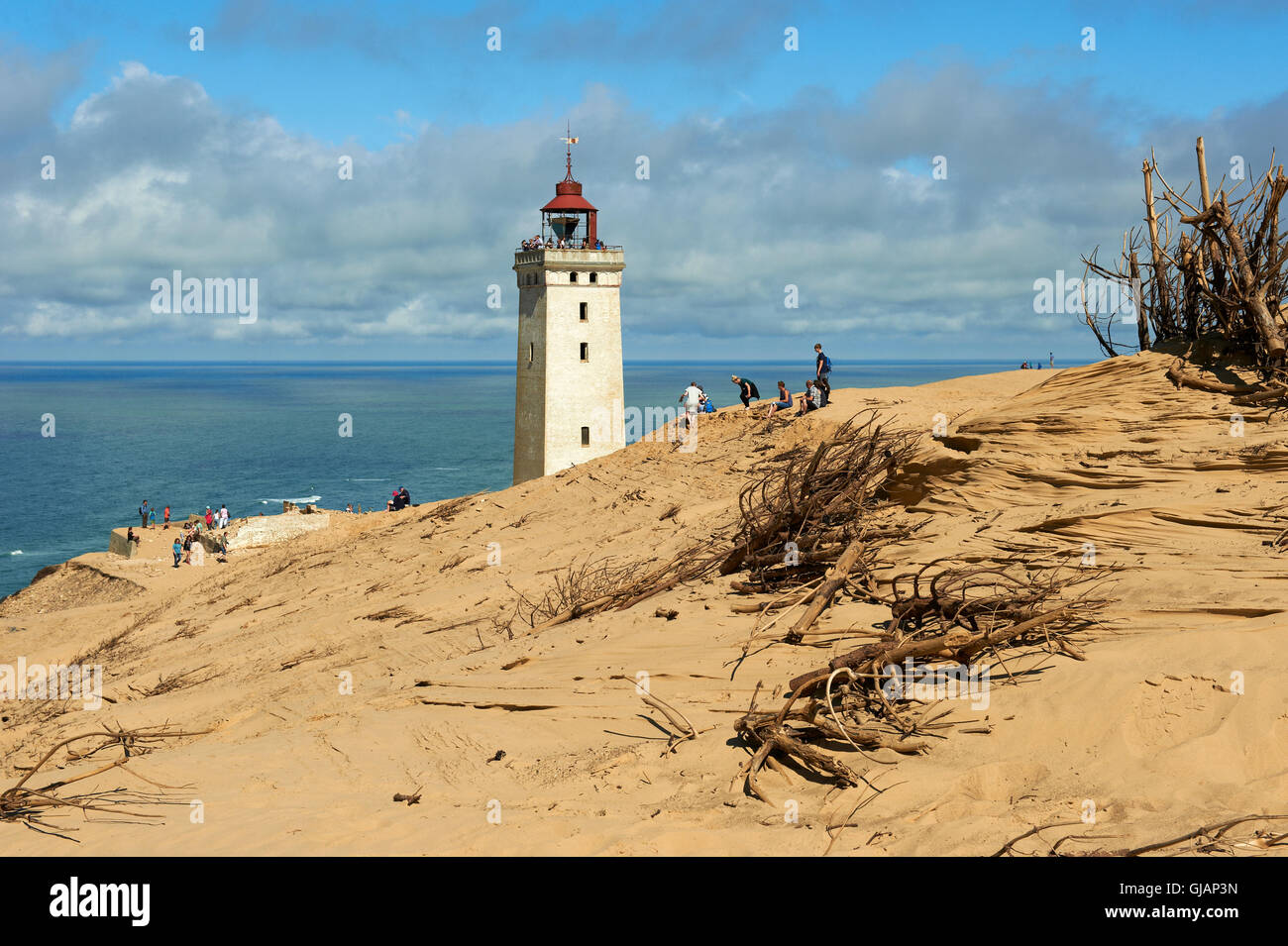 The old lighthouse, partially burried in sand, at Rubjerg Knude ...