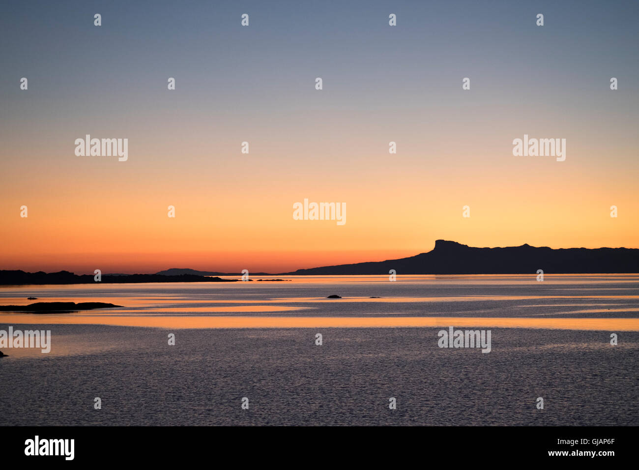 Sunset over the Hebridean island of Eigg from the Arisaig coastline on ...