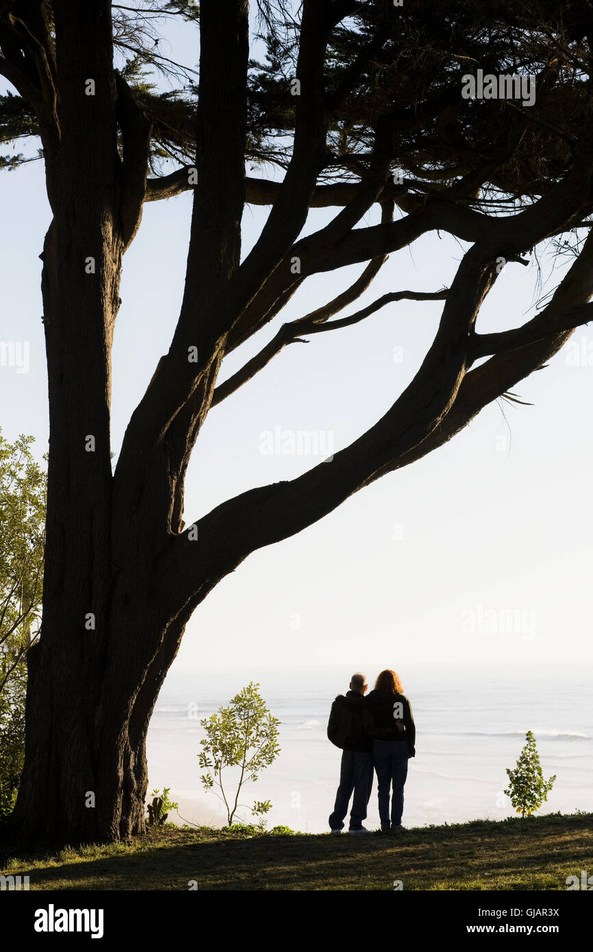 Couple Overlooking Ocean Stock Photo - Alamy