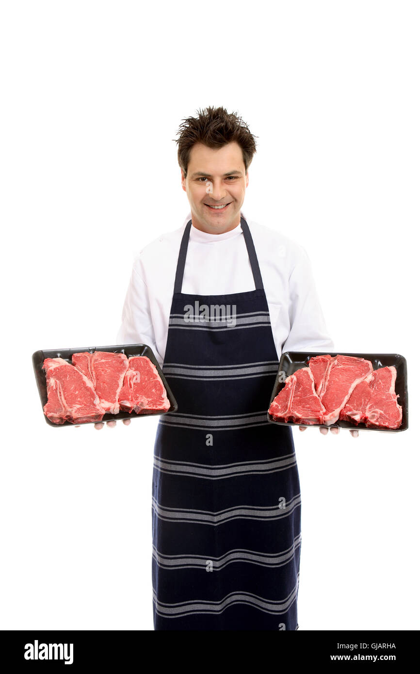 Butcher with trays of T-bone steak Stock Photo - Alamy