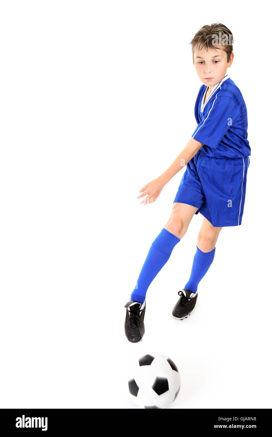 Child kicking ball Stock Photo - Alamy