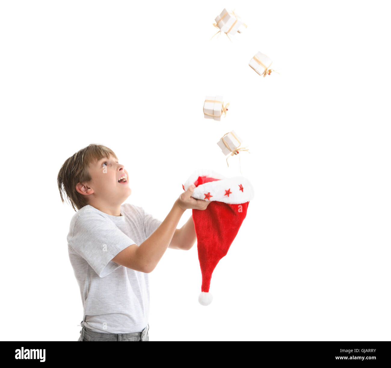 Boy catching falling presents Stock Photo - Alamy Boy catching falling presents Stock Photo - Alamy