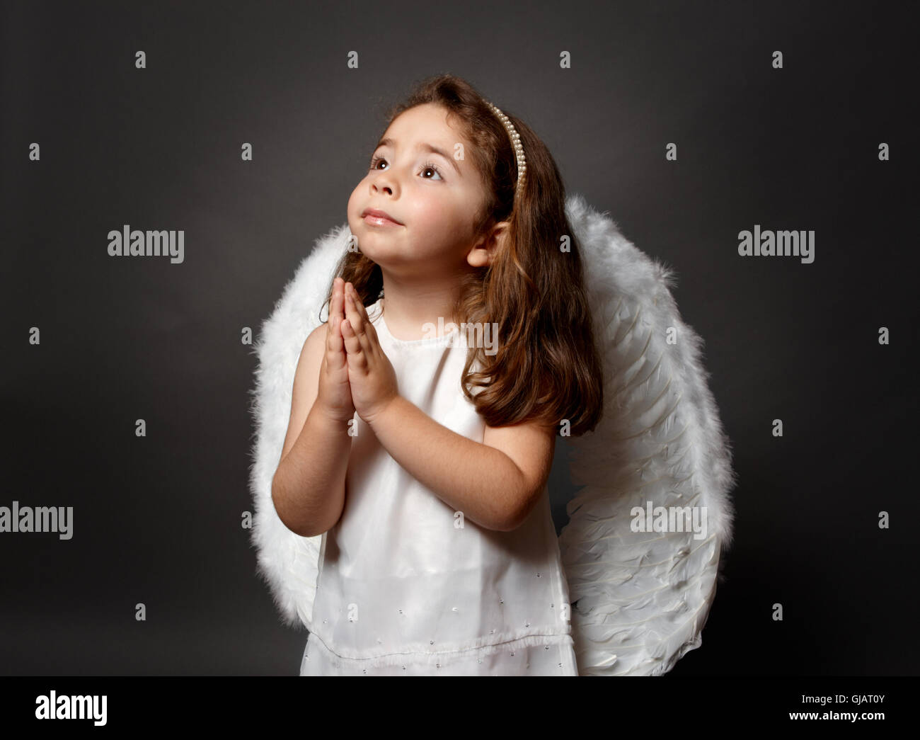 Holy angel praying Stock Photo - Alamy