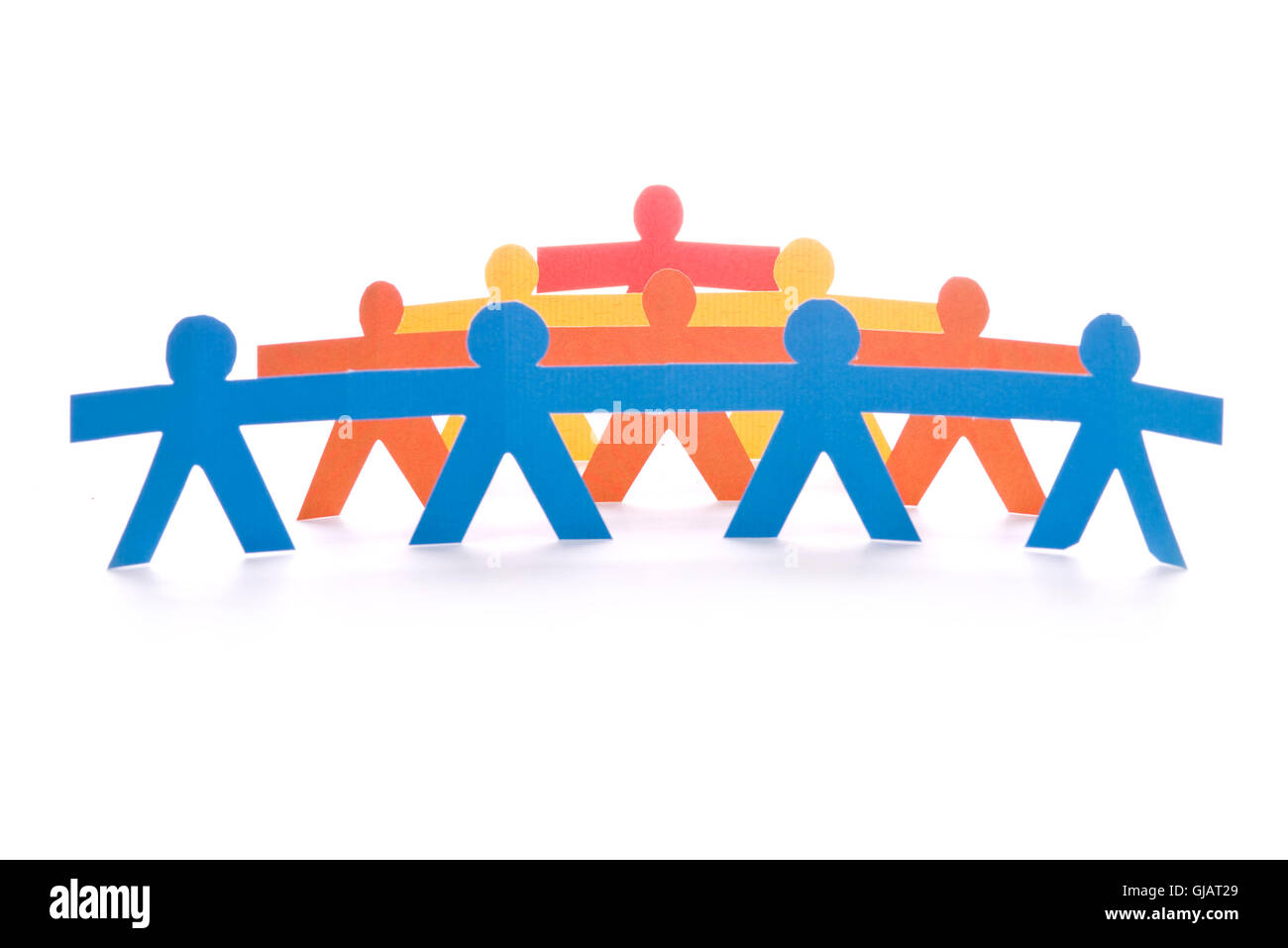 Concept of teamwork, colorful paper dolls Stock Photo - Alamy