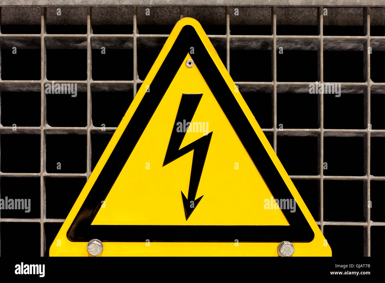 High Voltage Sign bolted on steel grid Stock Photo - Alamy