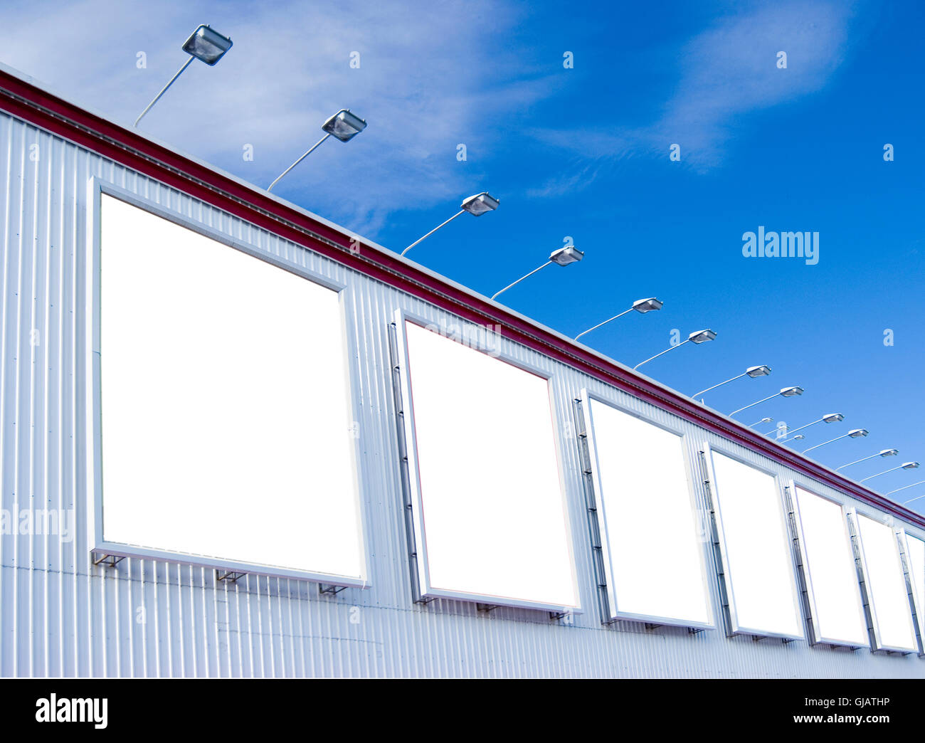multiple blank billboard with lamps Stock Photo - Alamy