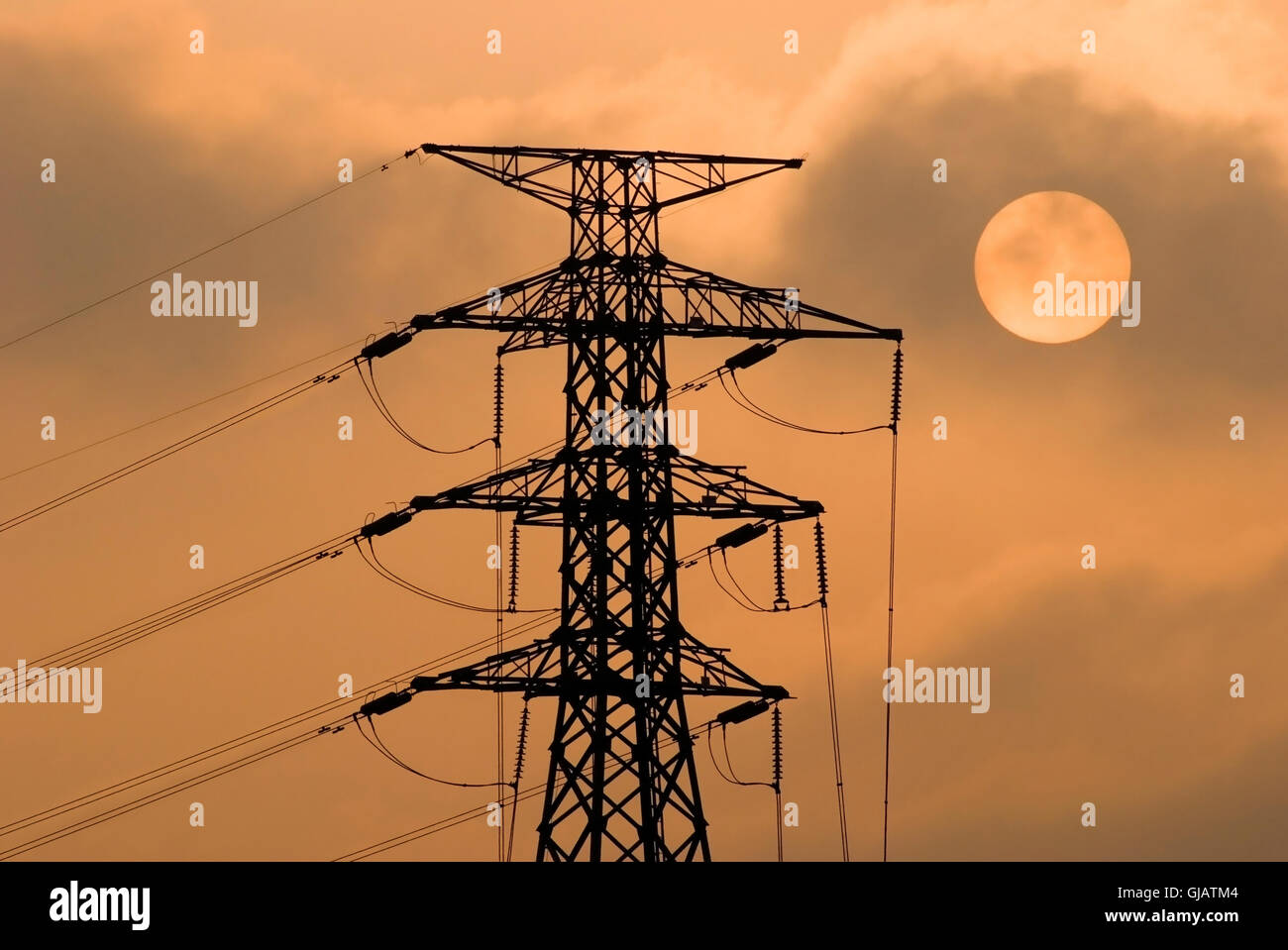 The electricity tower and sun Stock Photo - Alamy