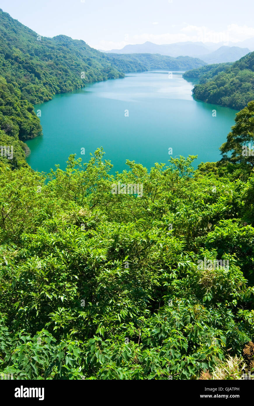 peaceful lake surround by forests and mountains Stock Photo - Alamy